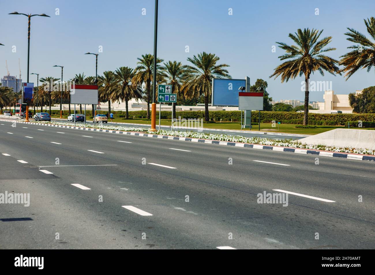 Asphalt road with modern city skyline of Dubai Stock Photo - Alamy