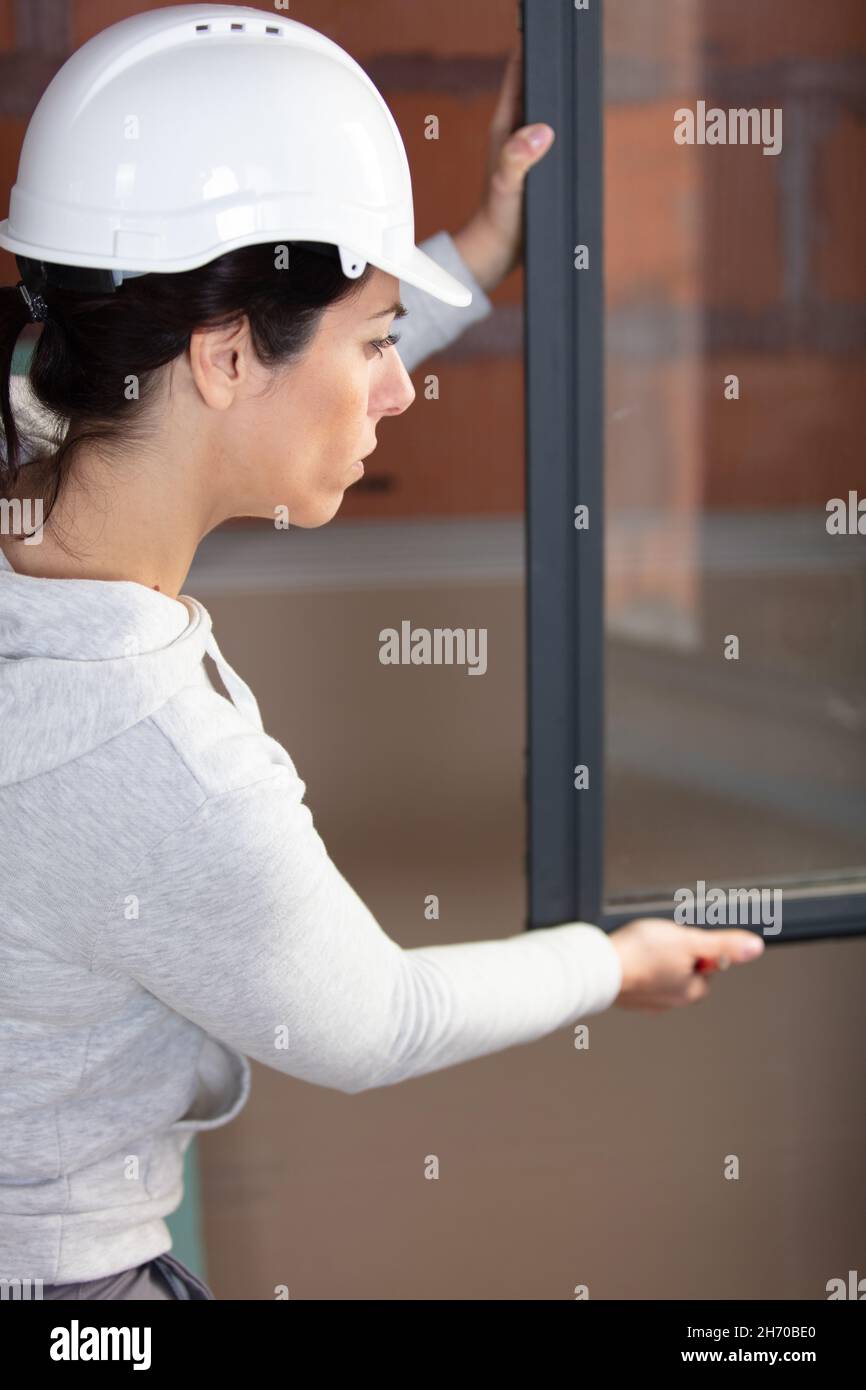 inspector or engineer checking and measuring the window Stock Photo - Alamy