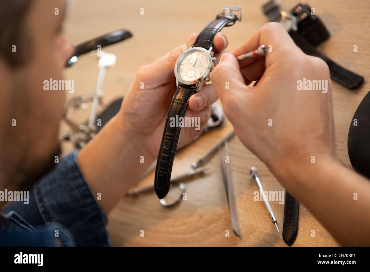 a watchmaker or repair man in action Stock Photo - Alamy