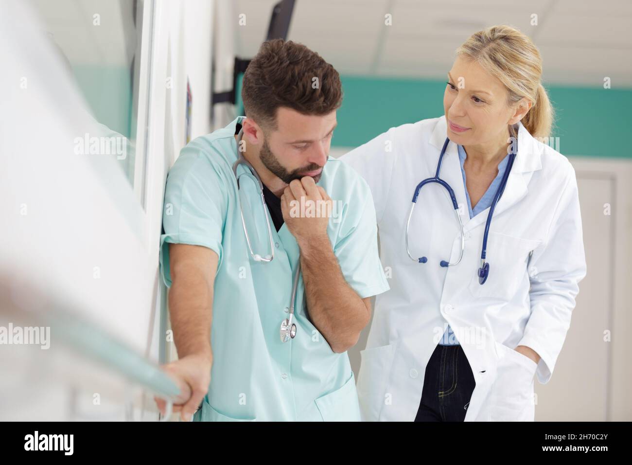 medical staff talking in hospital corridor Stock Photo - Alamy