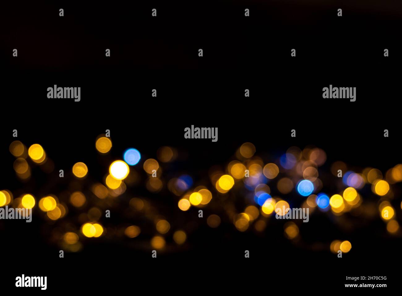 Beautiful background of defocused shiny blue and yellow round circles ...