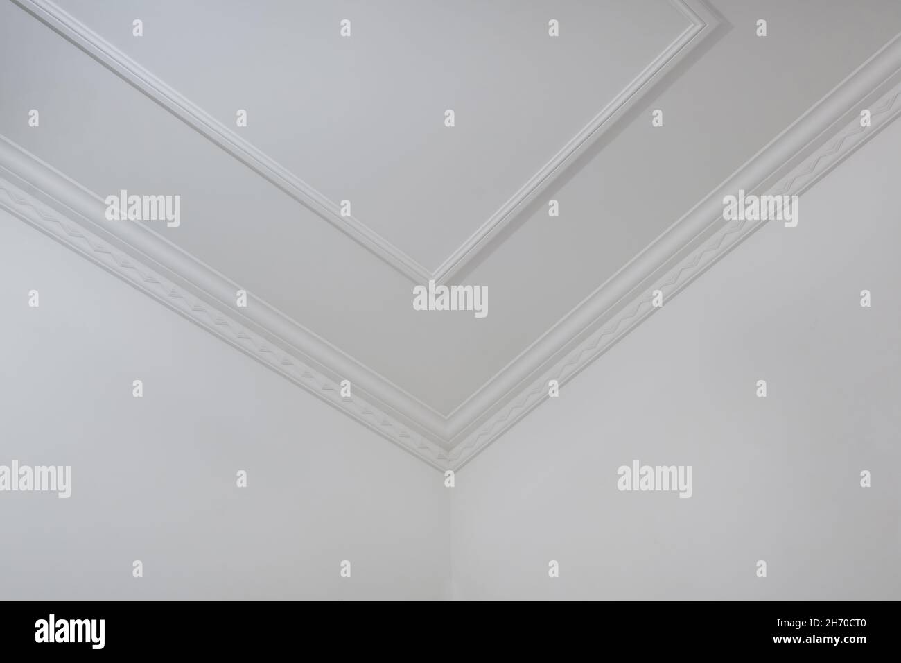 Detail of corner ceiling cornice with intricate crown molding Stock ...