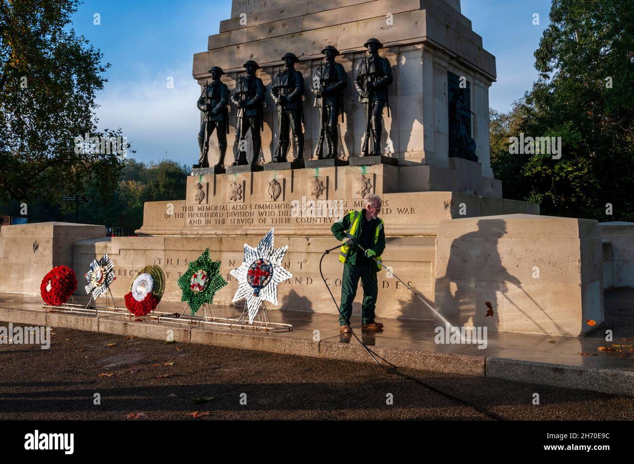 Worker cleaning the Guards Memorial, Guards Division War Memorial, in ...