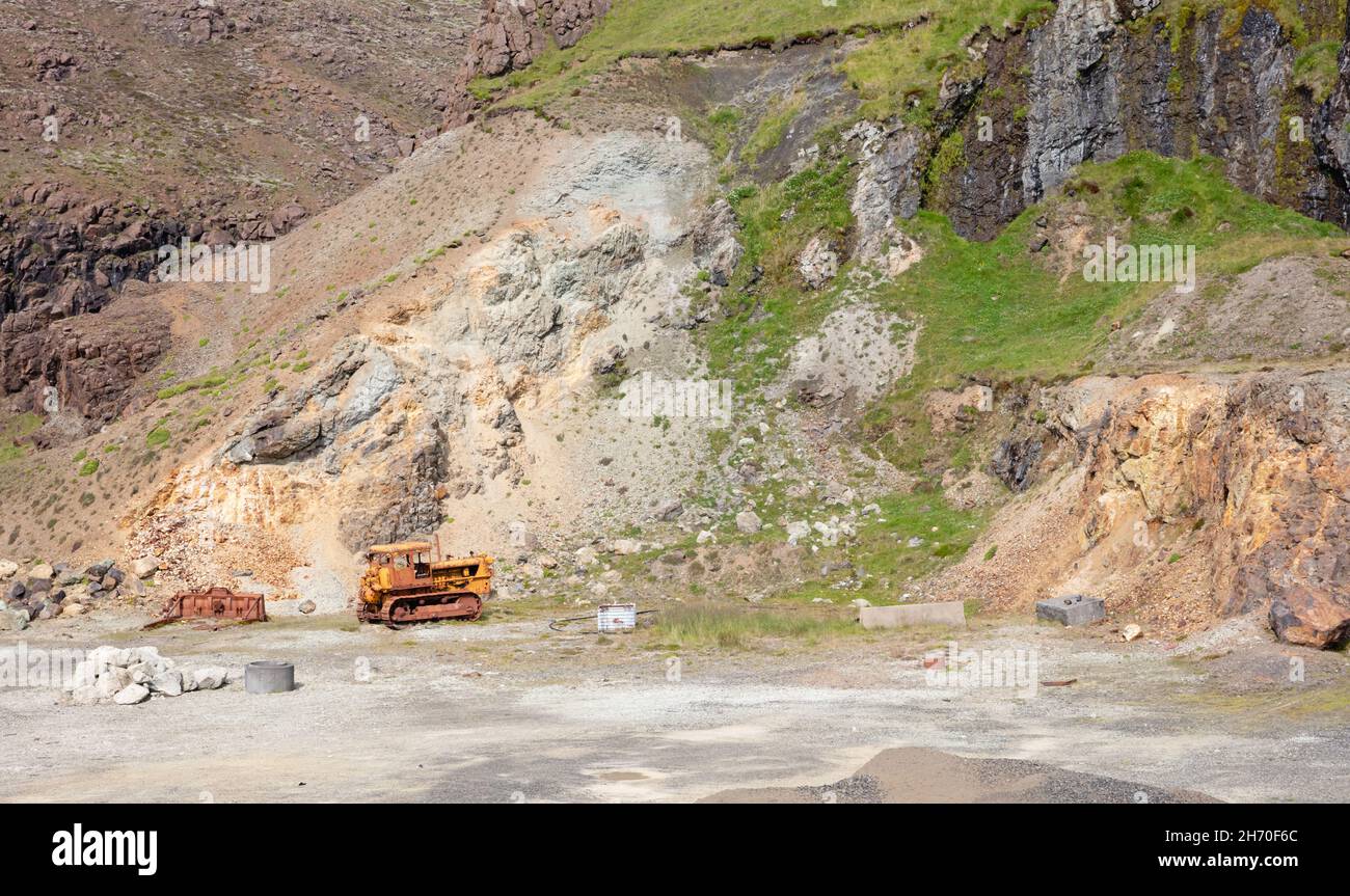 Old rusty crawler tractor with shovel, Iceland Stock Photo - Alamy