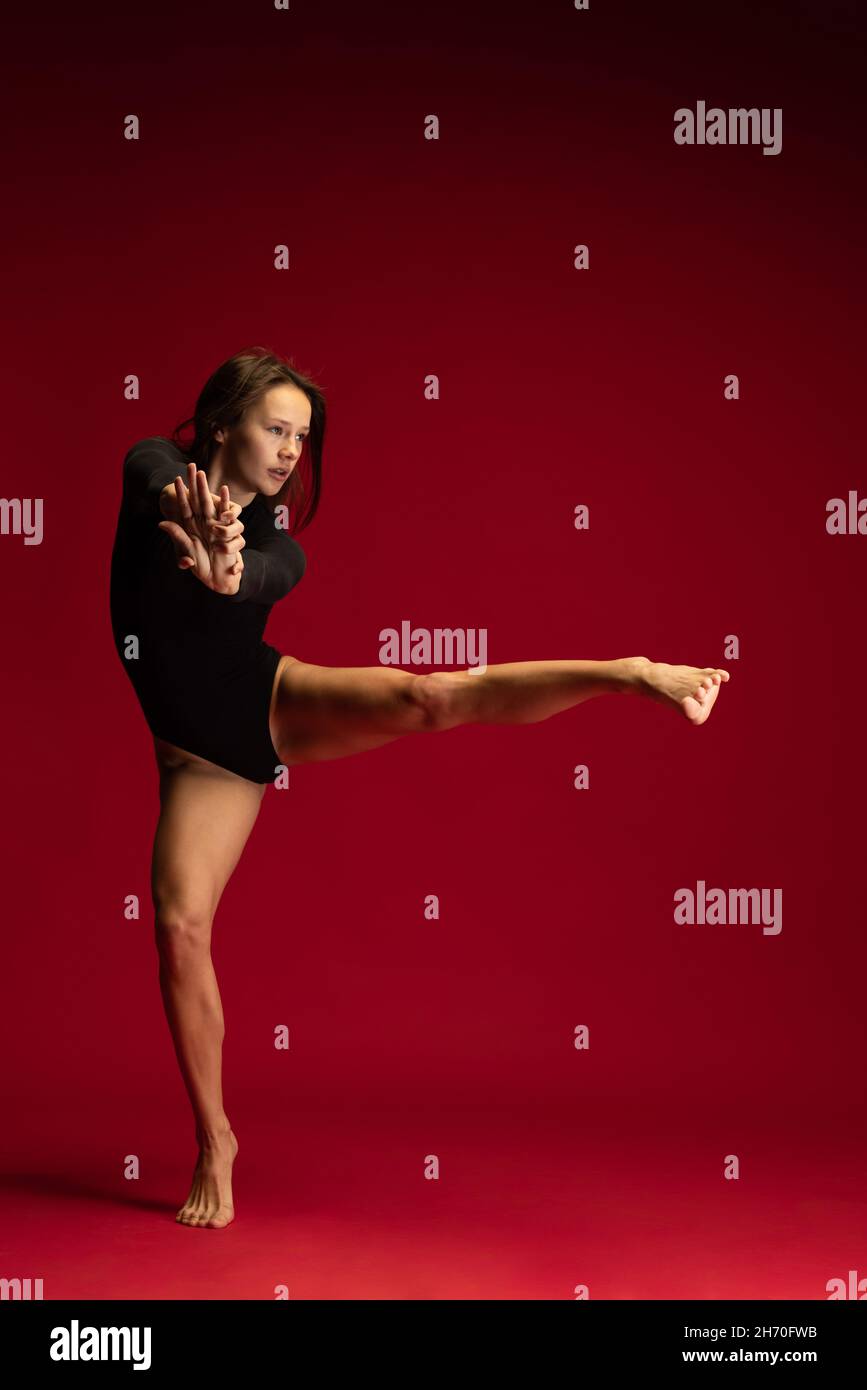 Portrait of emotional young flexible contemp dancer, ballerina dancing ...
