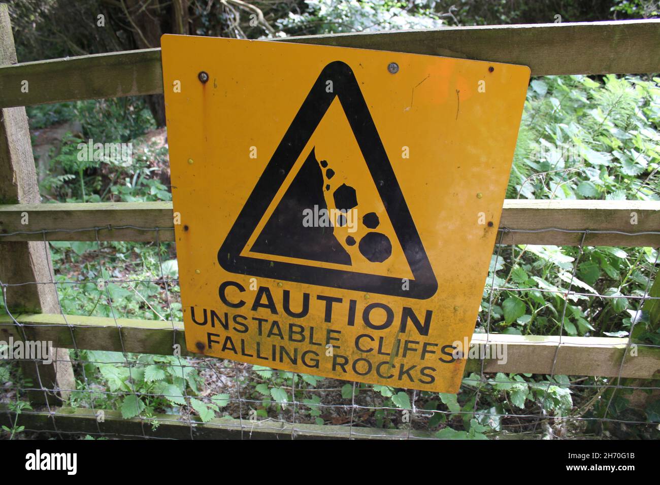 Caution unstable cliffs falling rocks sign. The England south west ...