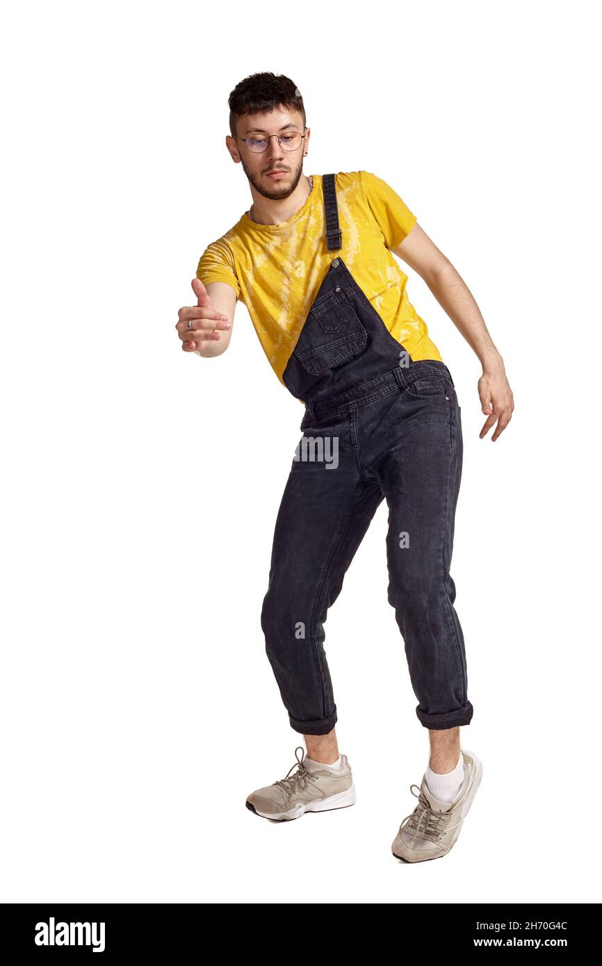 Full-length portrait of a funny guy dancing in studio isolated on white ...