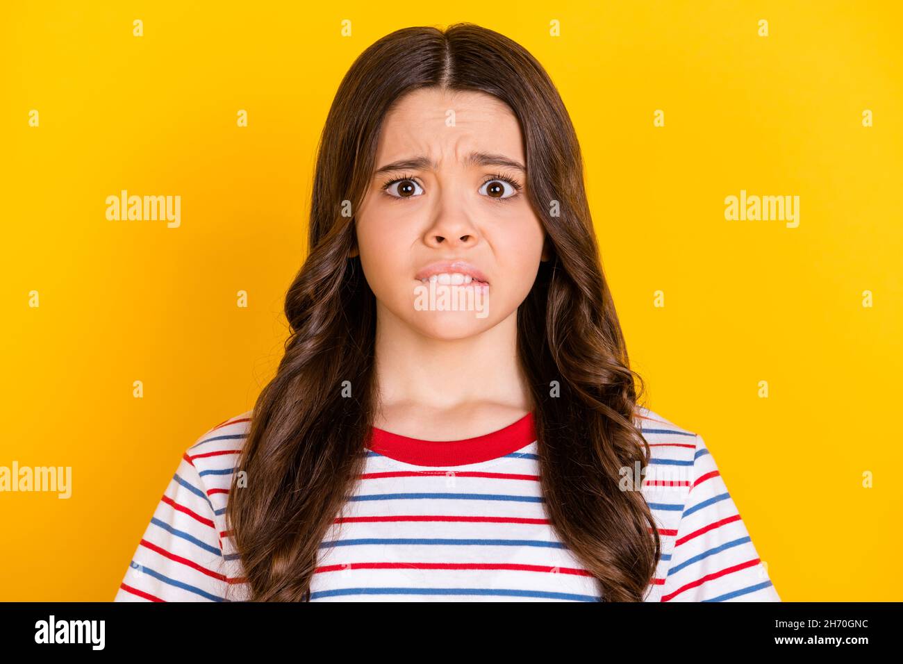 Photo of young scared afraid nervous little girl panic bite lips having ...