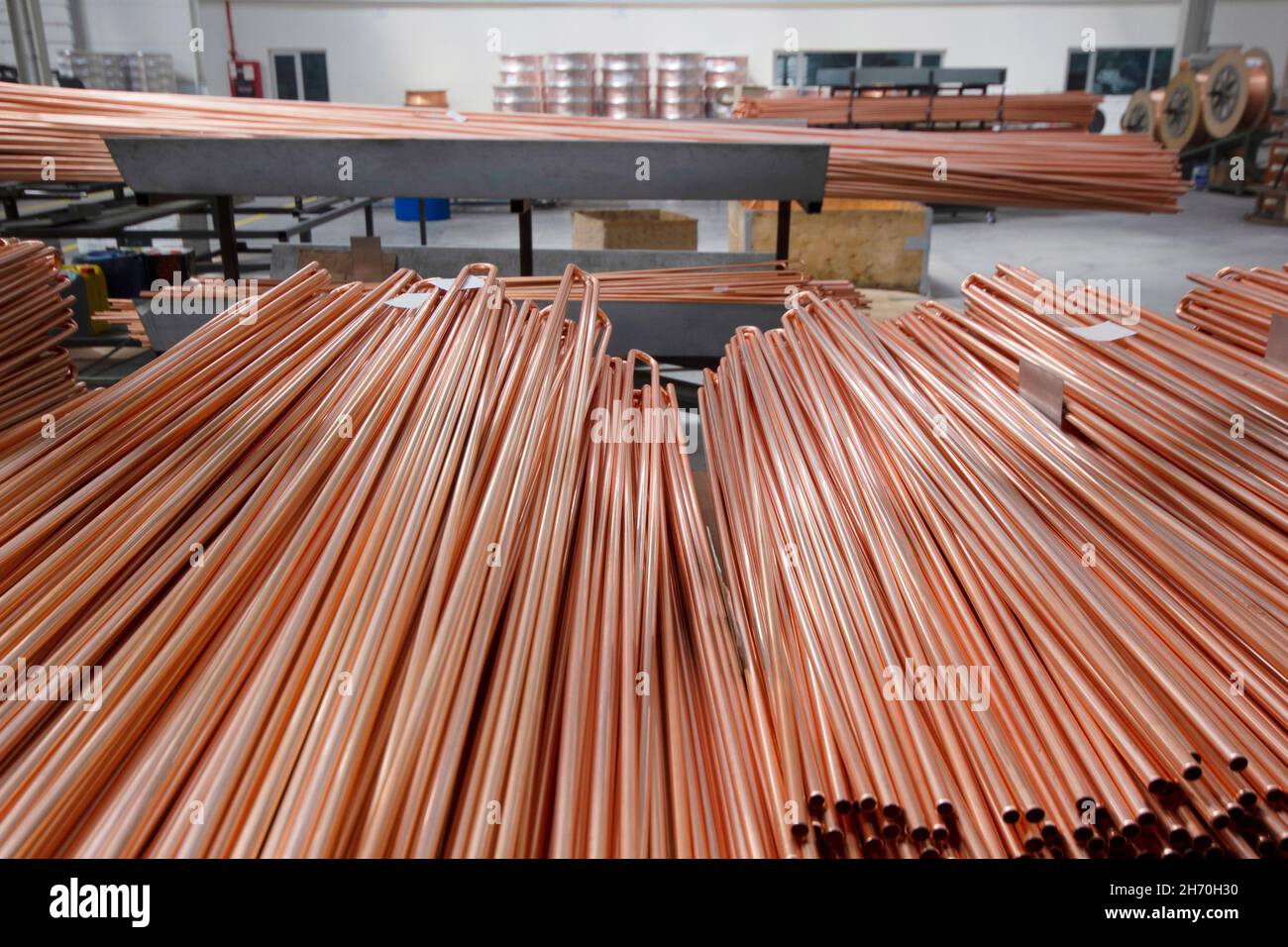 Copper pipes in factory, industrial background Stock Photo - Alamy