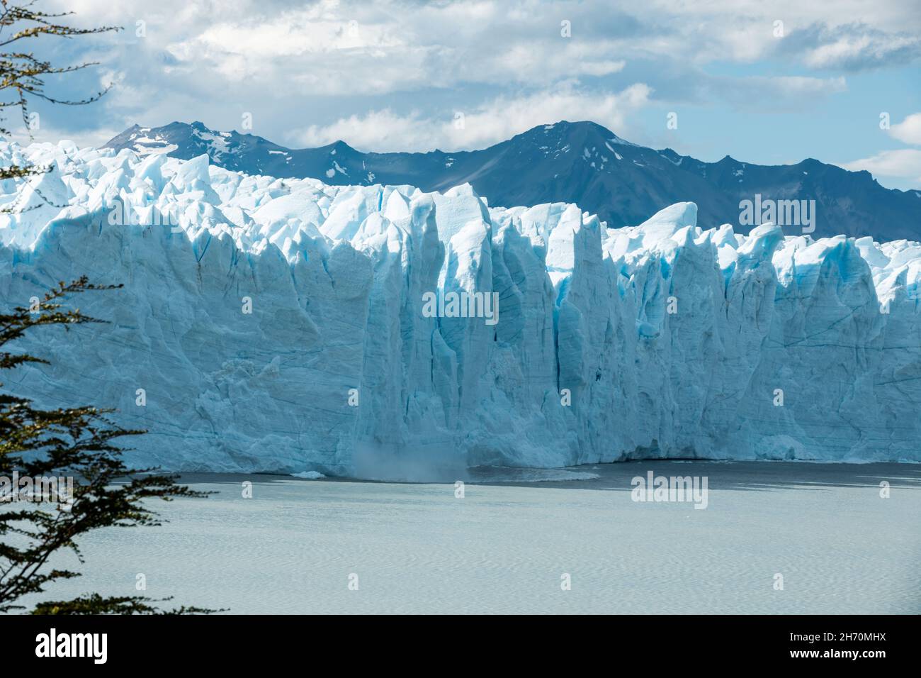 Small ice chunks from the edge of Perito Moreno Glacier are falling and ...