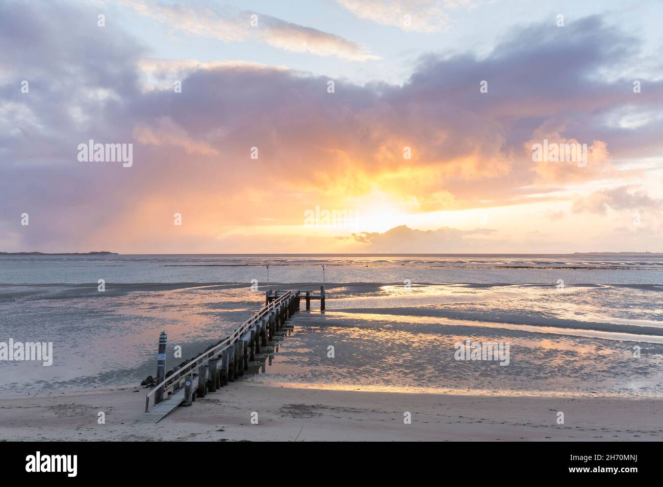 Simple pier in Utersum at sunset. Foehr Island, Schleswig-Holstein ...