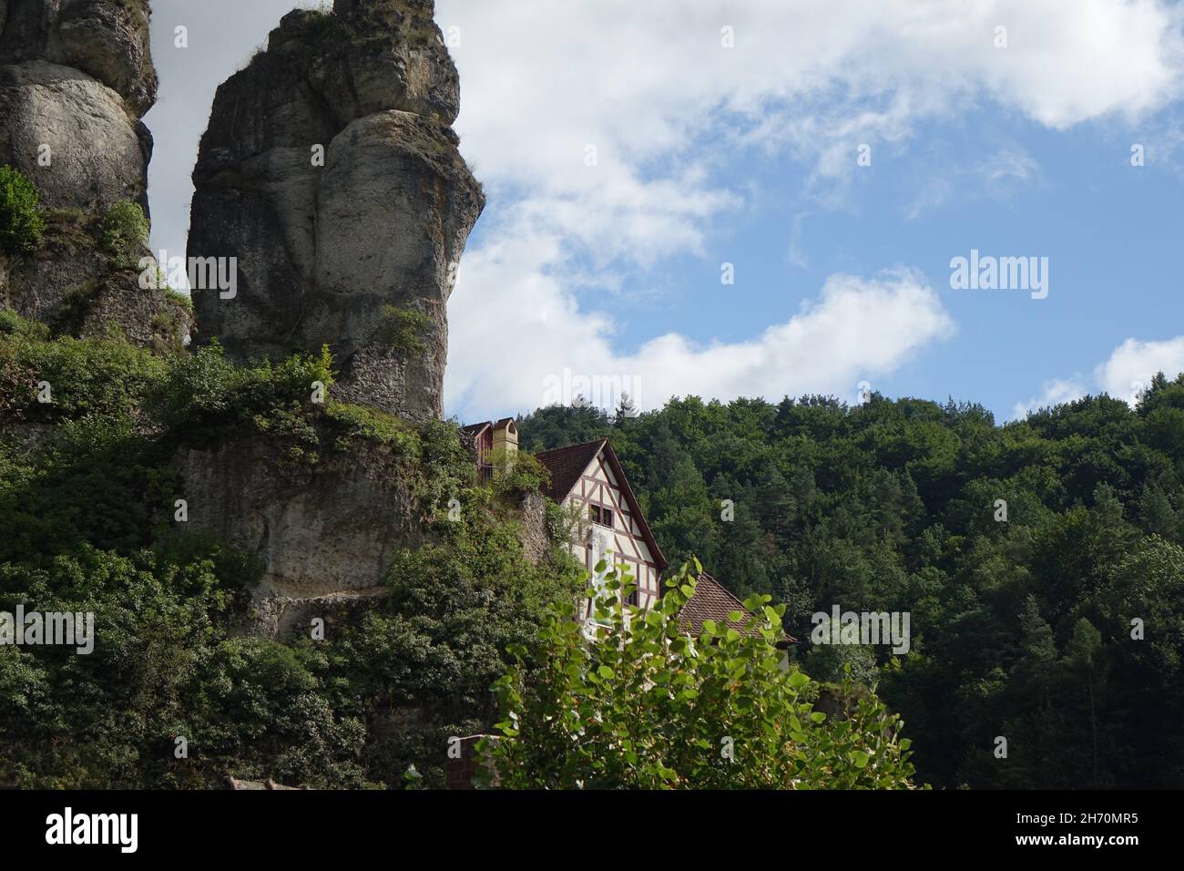 Famous rocks with lookout point Fahnenstein over traditional German ...