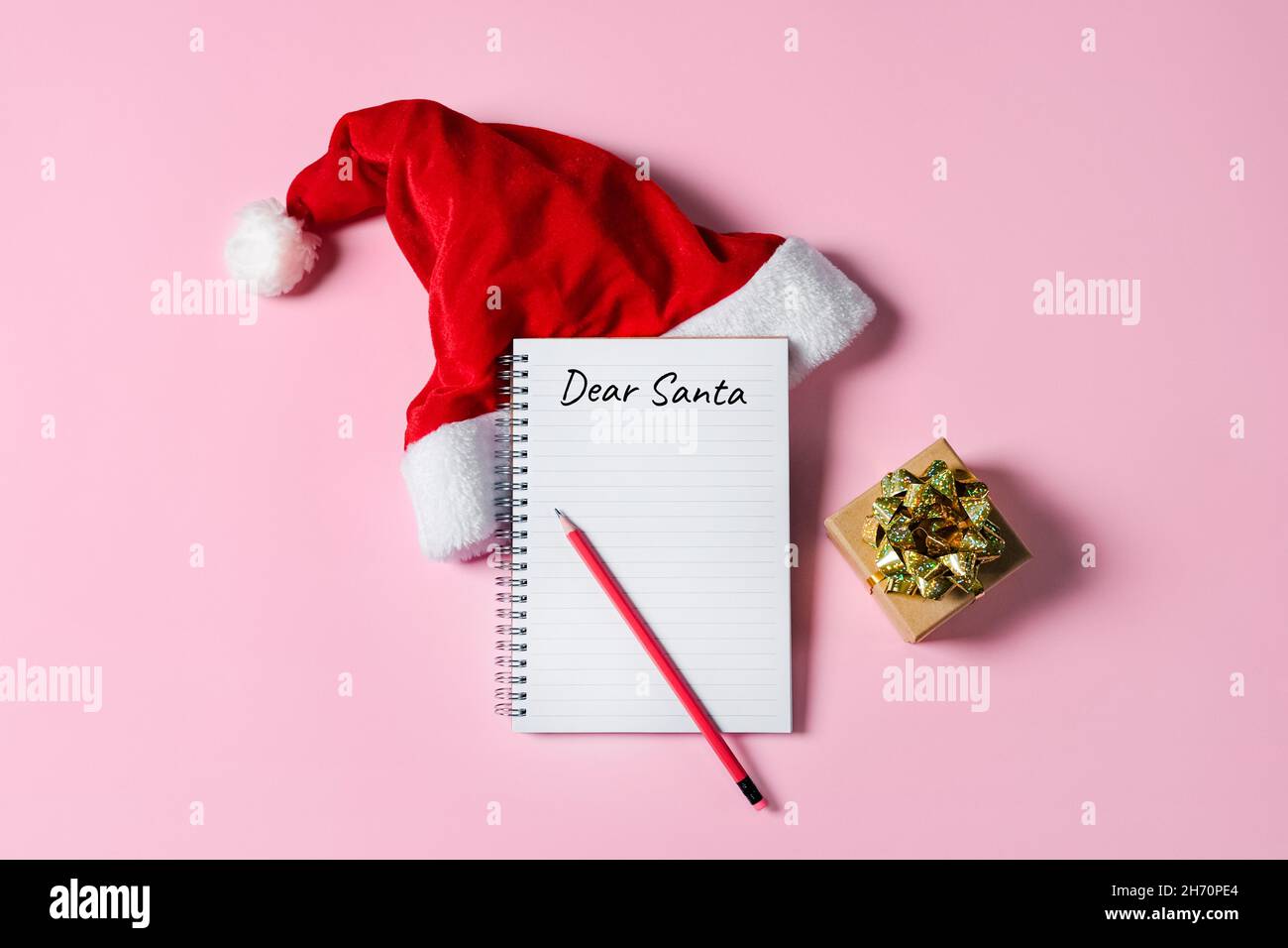 Dear Santa letter concept. Writing in Notepad letter to Santa Claus on ...
