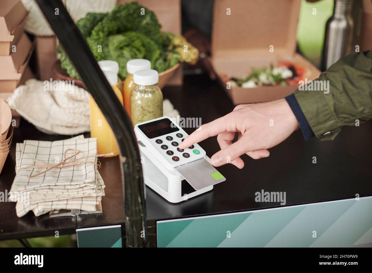 Close-up of person using card reader Stock Photo - Alamy