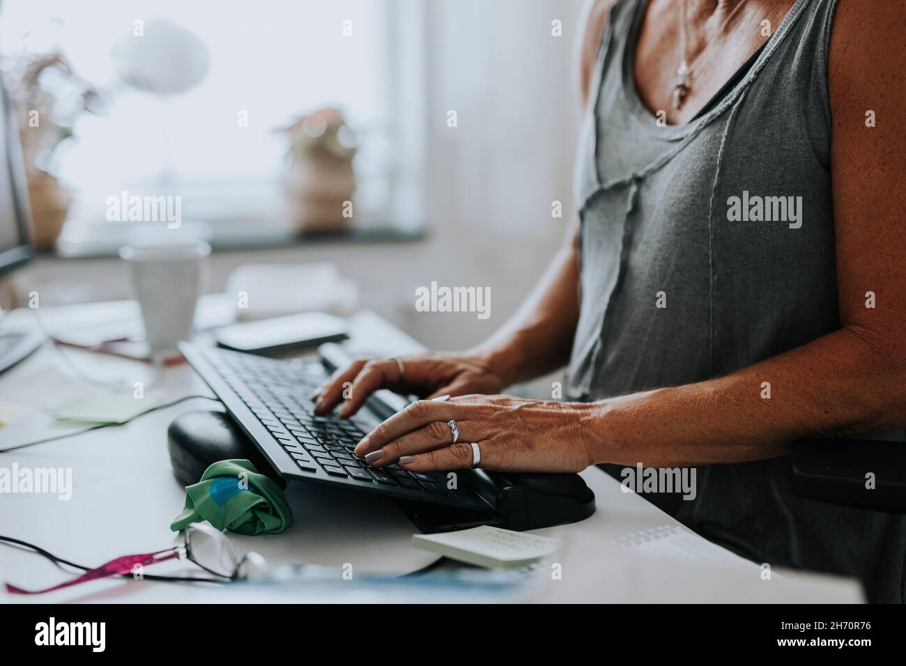 Woman's hands using computer Stock Photo - Alamy