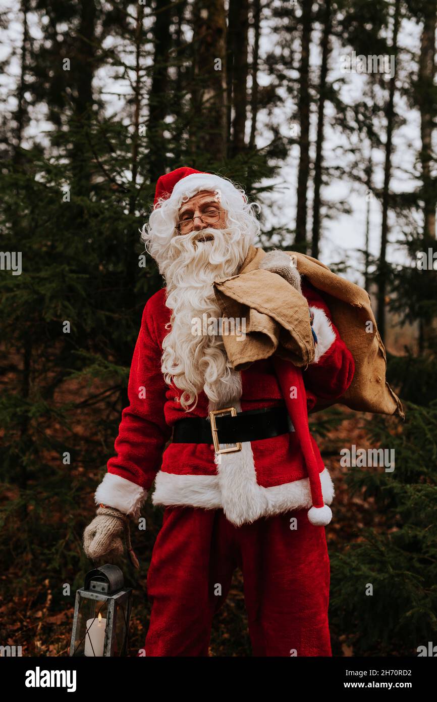 Person in santa costume carrying hi-res stock photography and images ...