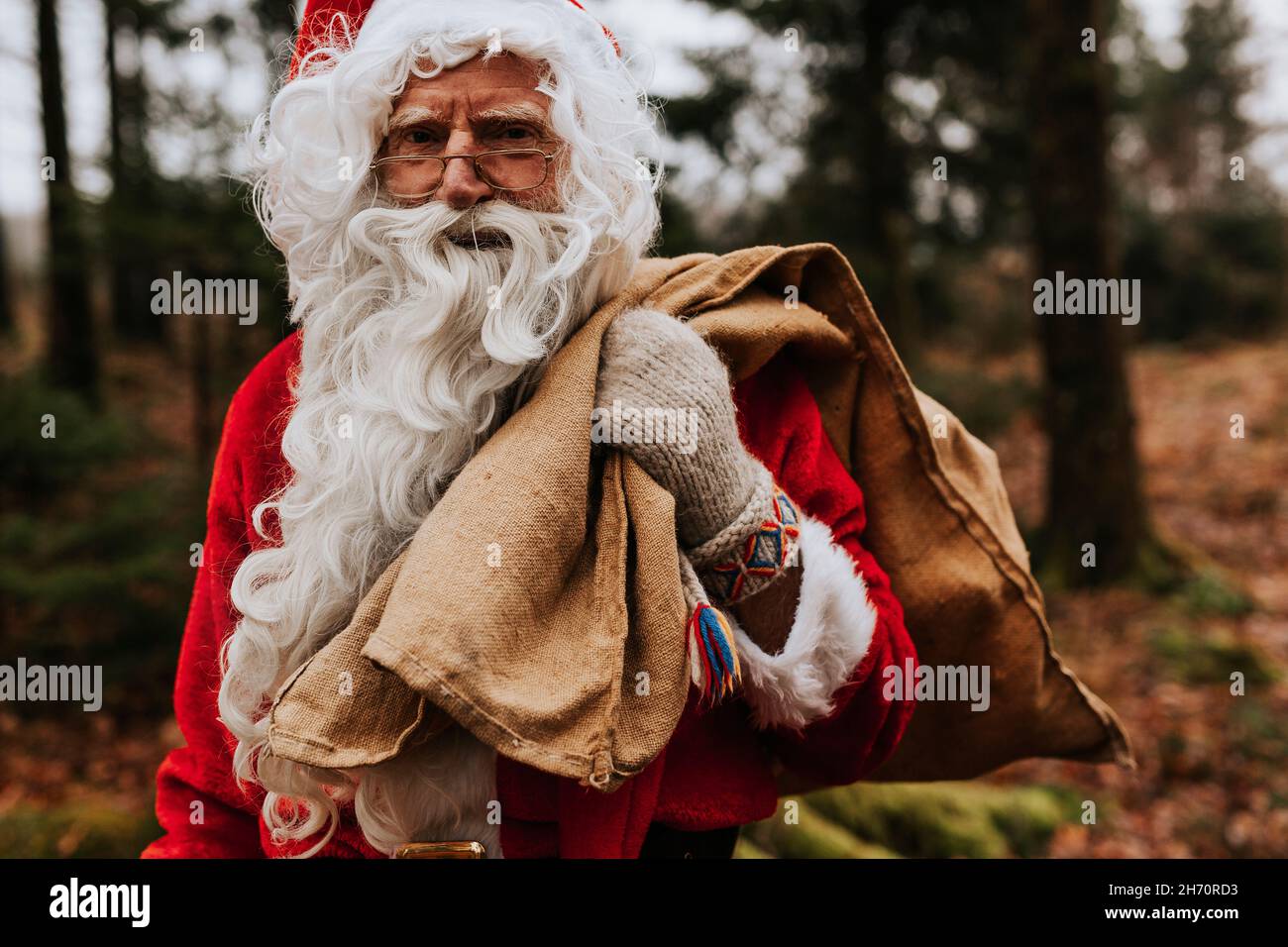 Person in santa costume carrying hi-res stock photography and images ...