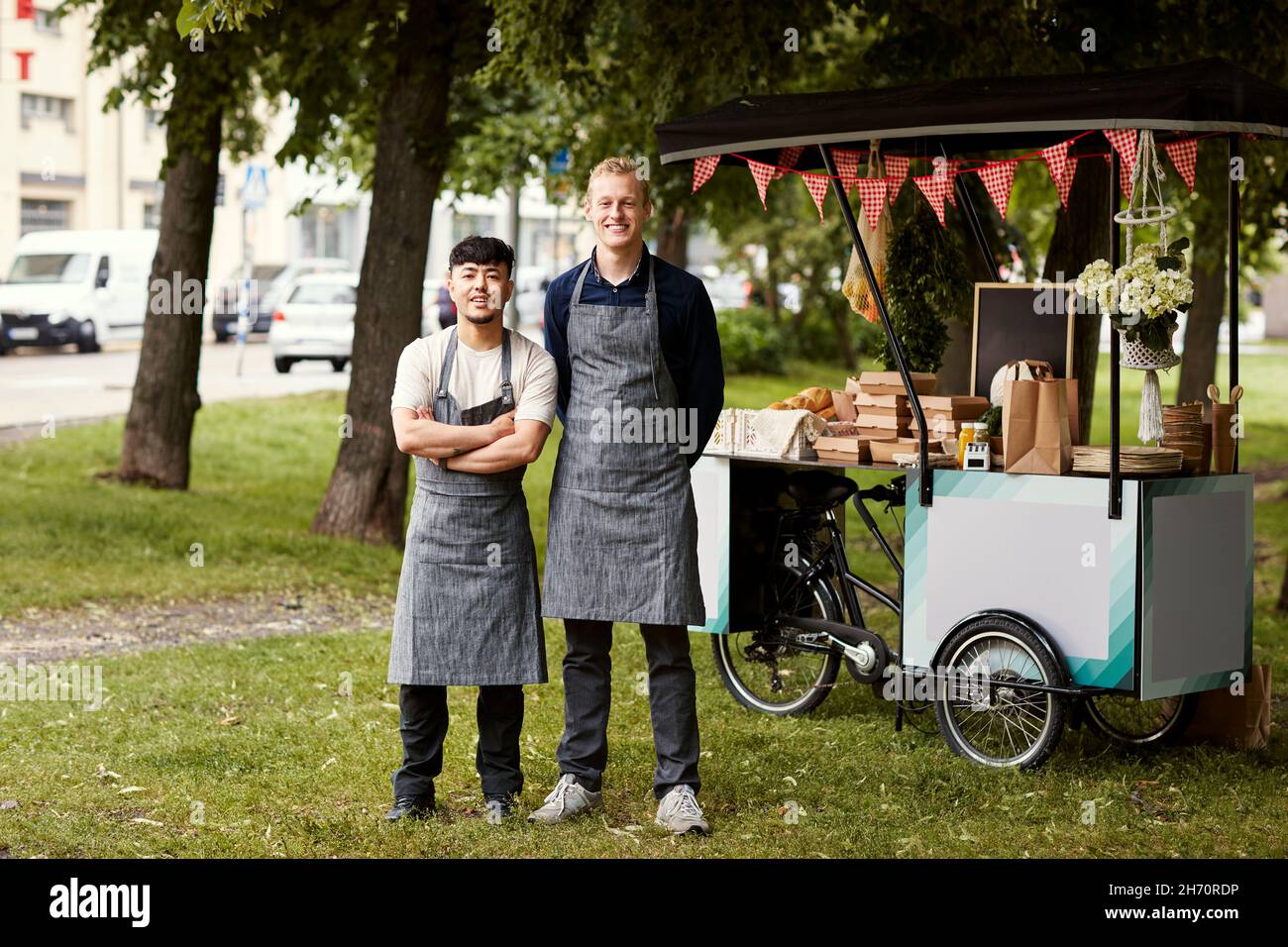 Men at food stall Stock Photo - Alamy