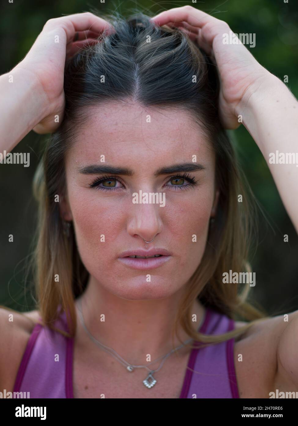Portrait of girl model athlete posing on running track Stock Photo - Alamy