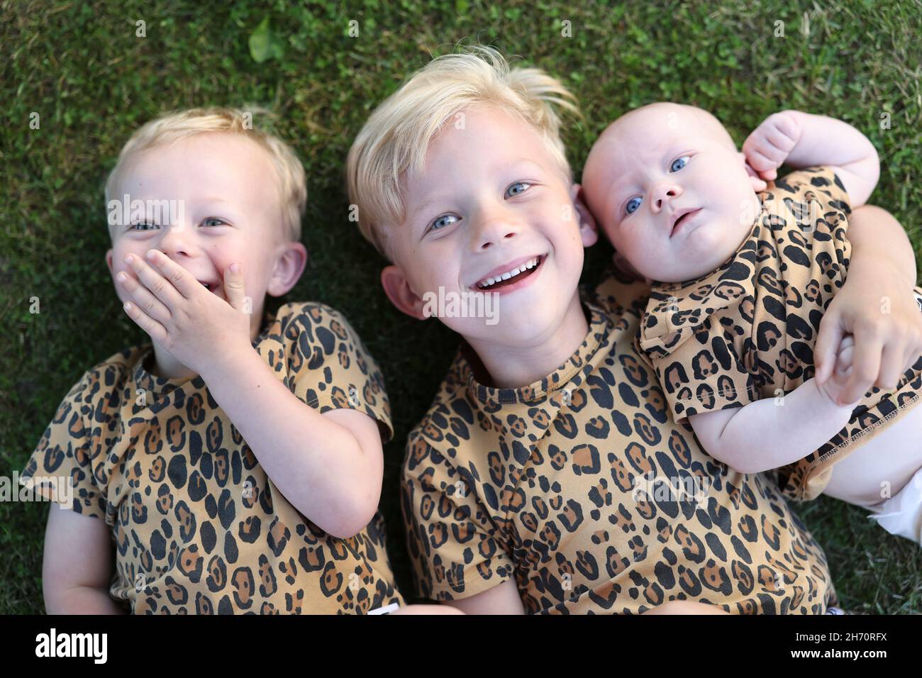 Happy brothers looking away Stock Photo - Alamy