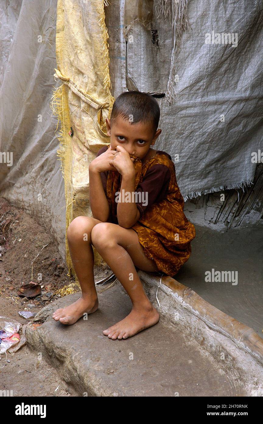 Portrait of a seated young kid. India Stock Photo - Alamy