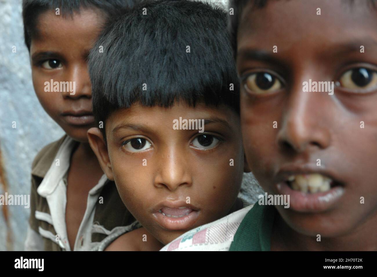 Three kids posing for the camera. India Stock Photo - Alamy
