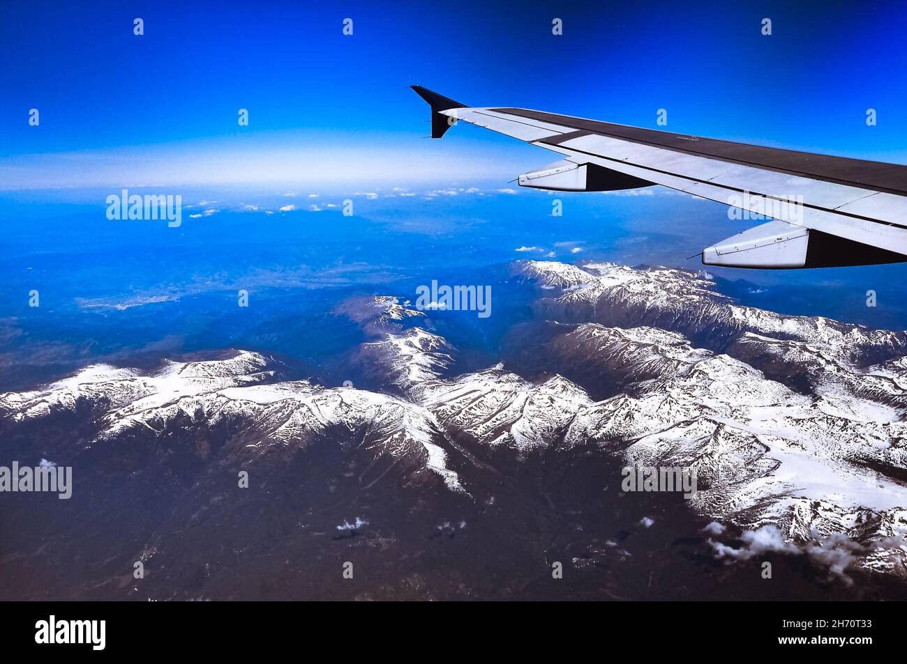 Looking through window aircraft during flight in wing with a nice blue ...