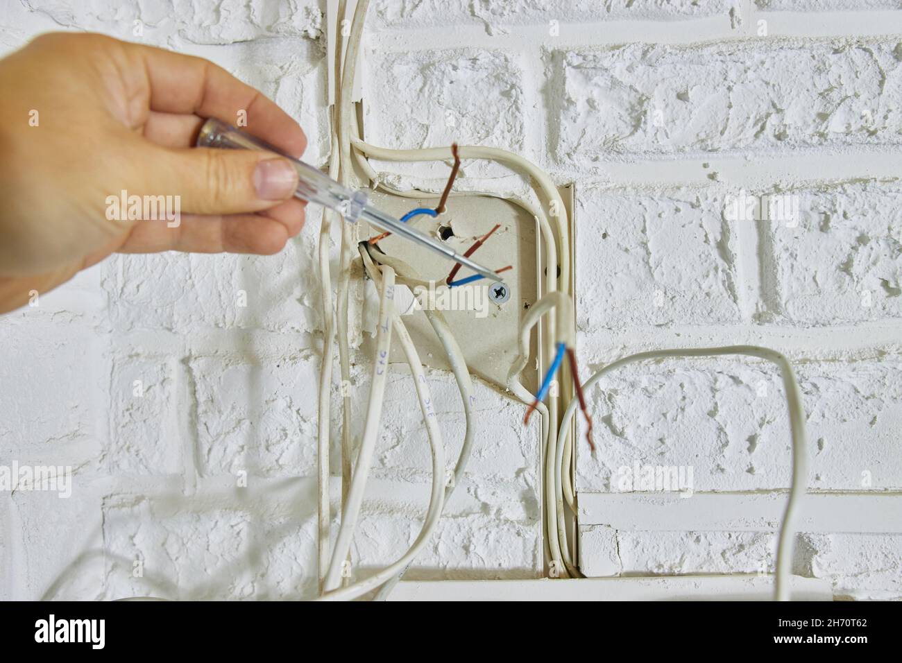 repair and replacement of electrical cables in the house Stock Photo ...