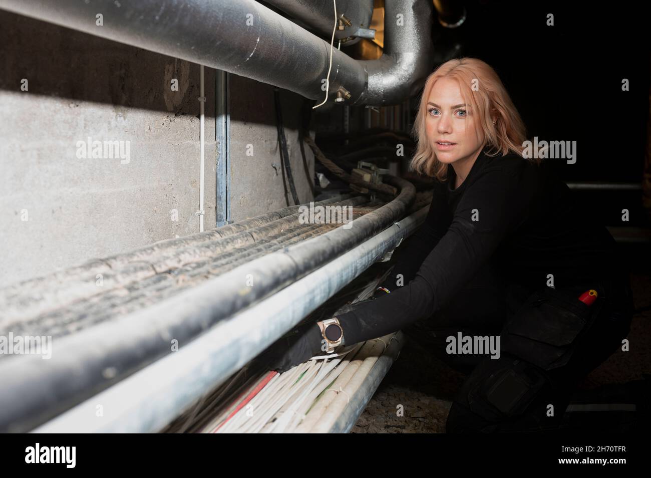 Female electrician at work Stock Photo - Alamy