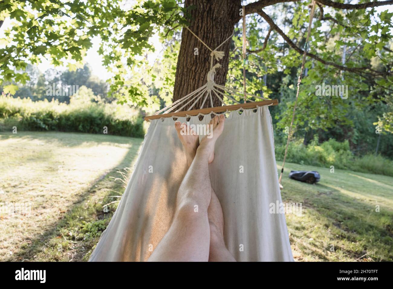 Male legs in hammock Stock Photo - Alamy
