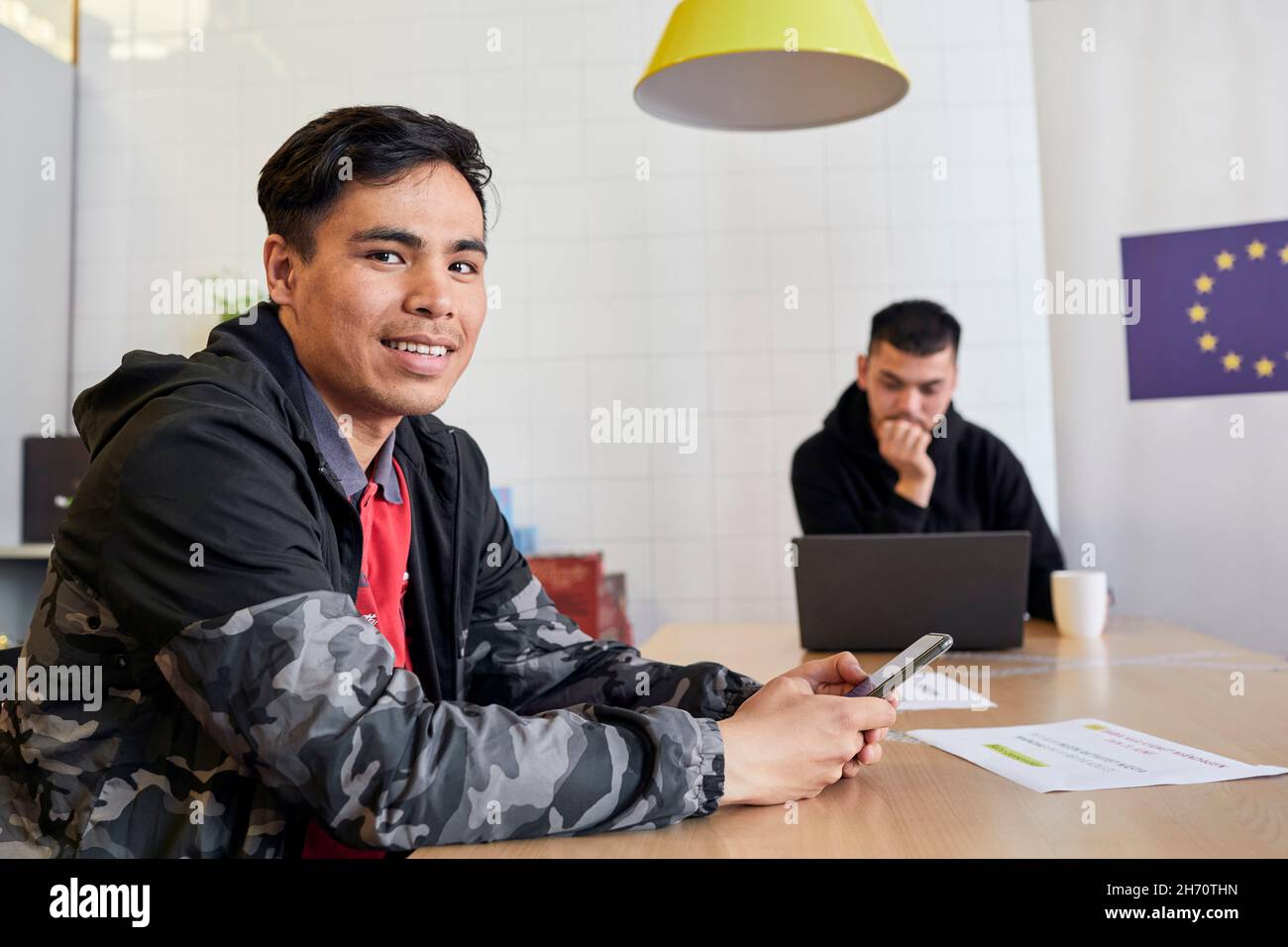 Young men at job center Stock Photo - Alamy