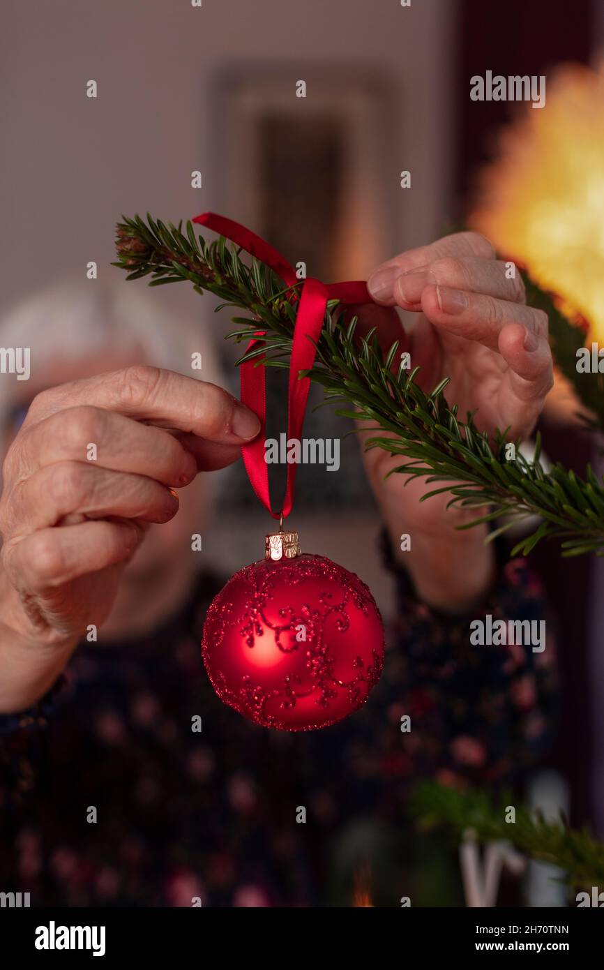 Womans hand decorating xmas tree hi-res stock photography and images ...
