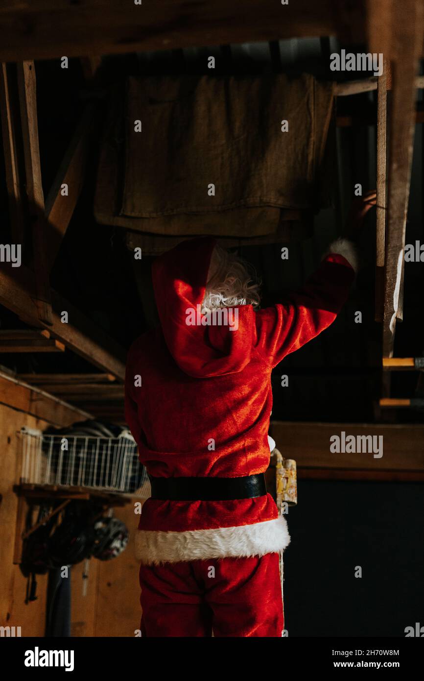 Rear view of person wearing Santa costume Stock Photo - Alamy