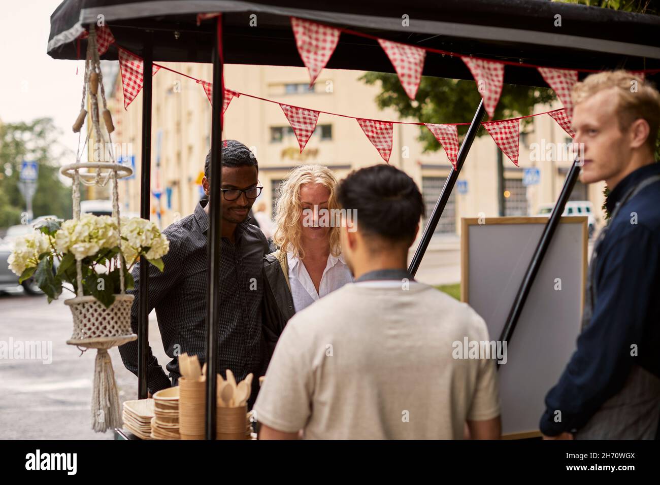 People at food stall Stock Photo - Alamy
