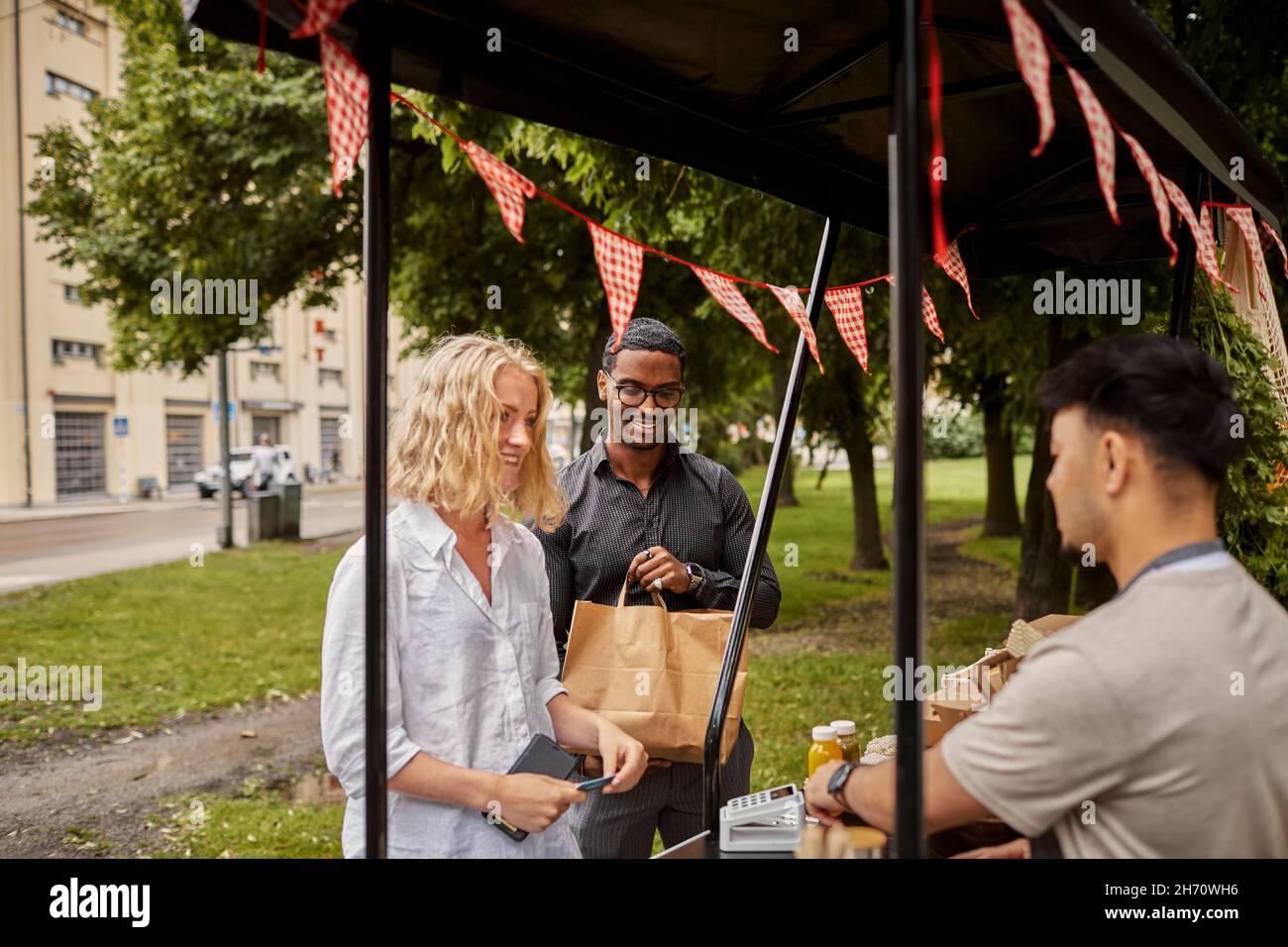 People at food stall Stock Photo - Alamy