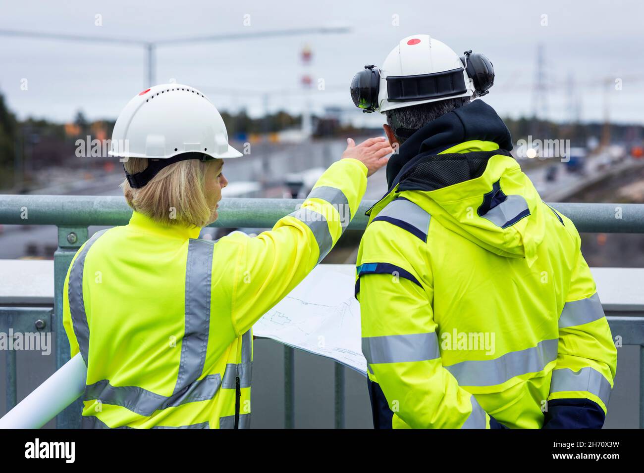 People talking on building site Stock Photo - Alamy