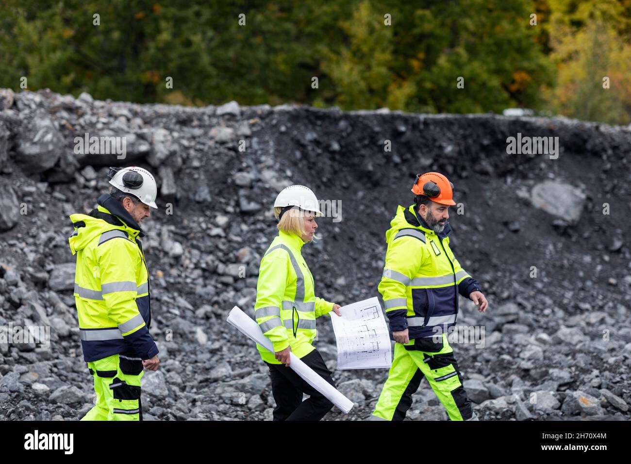 Construction workers at site Stock Photo - Alamy