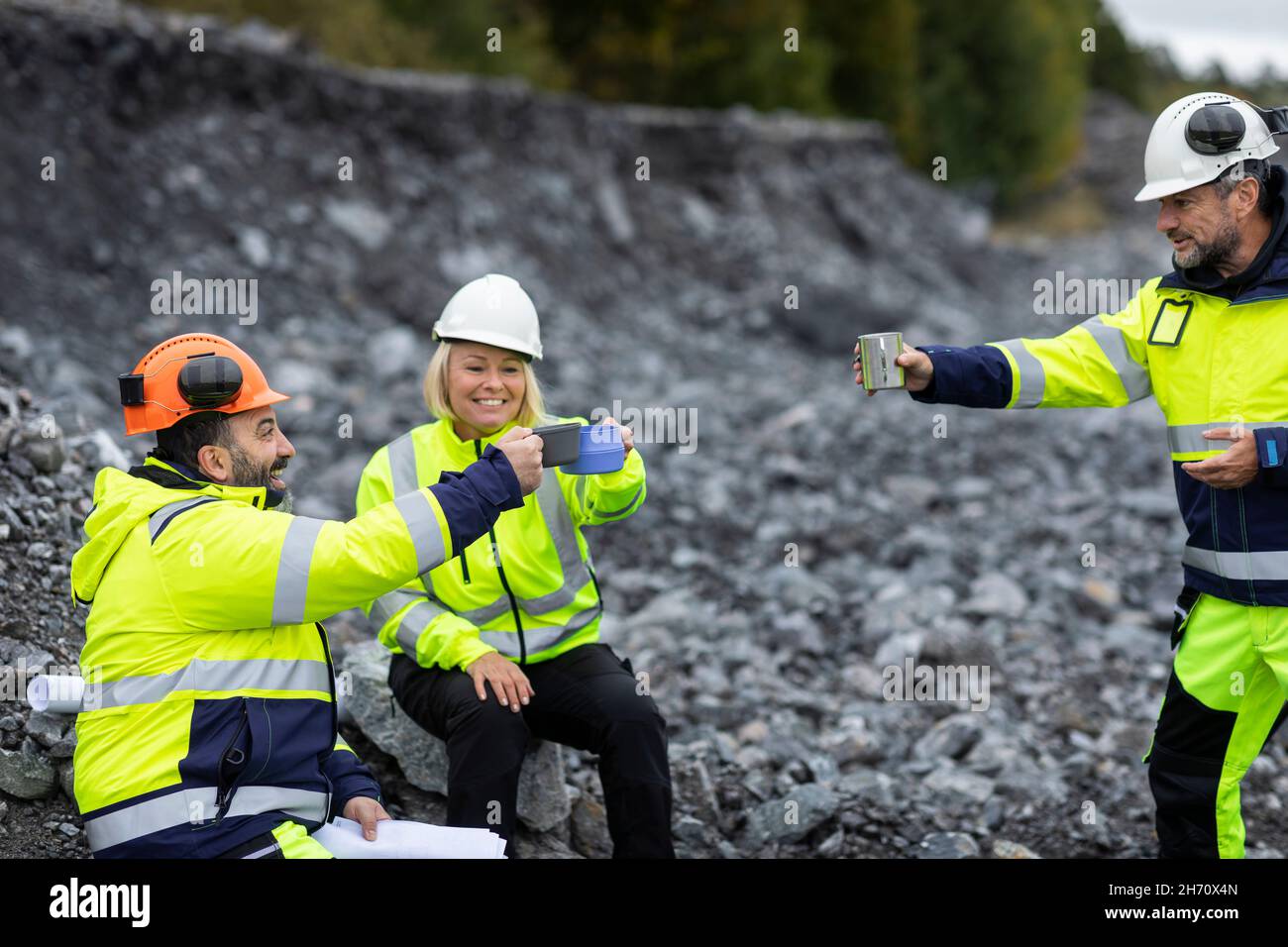 Construction workers having break Stock Photo - Alamy
