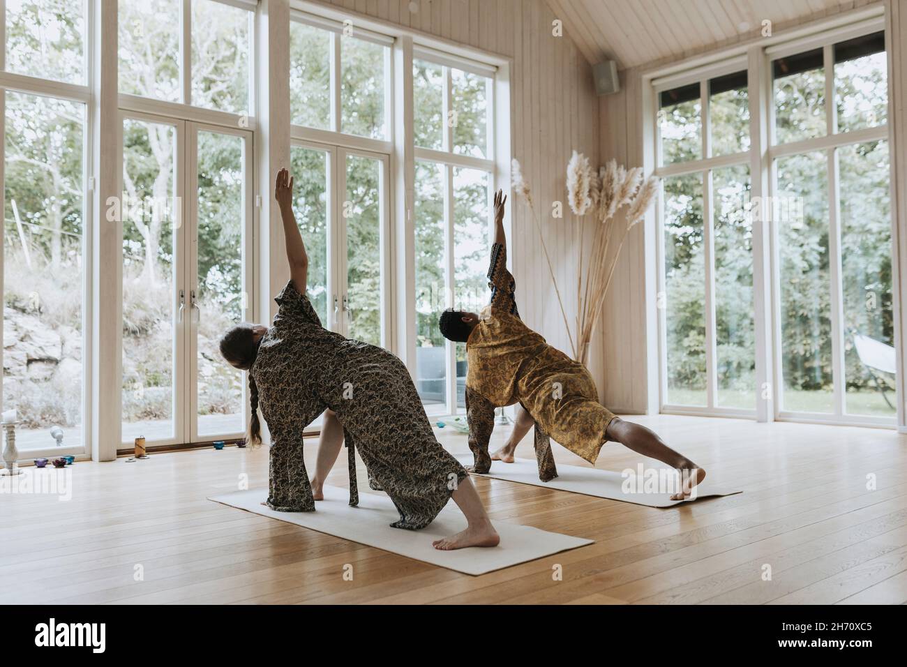 Man and woman doing yoga Stock Photo - Alamy