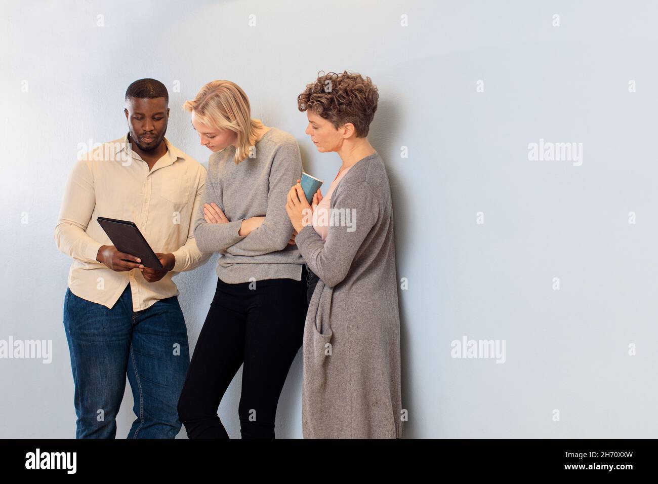 People talking at corridor Stock Photo - Alamy