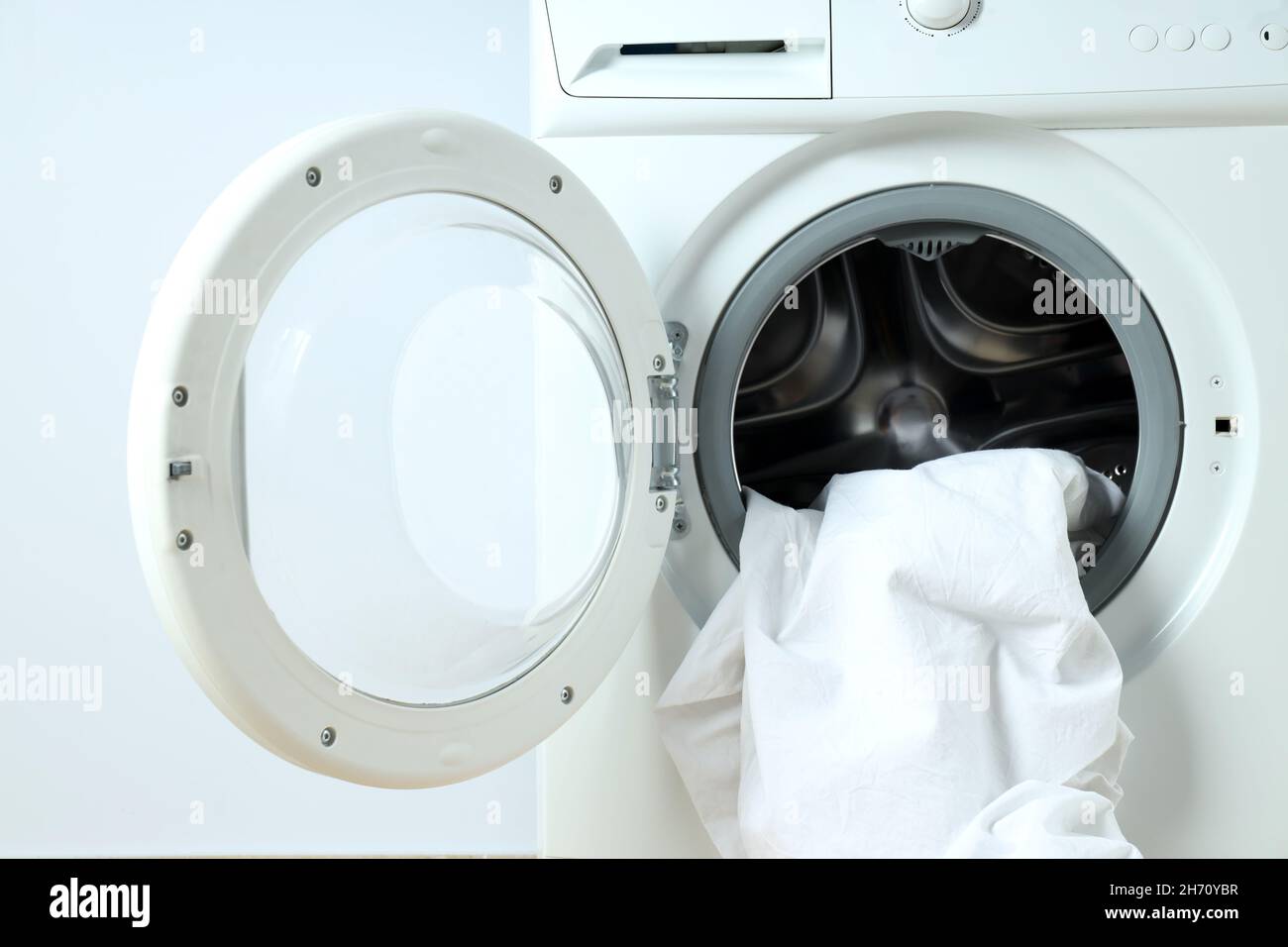 Concept of housework with washing machine on white background Stock ...