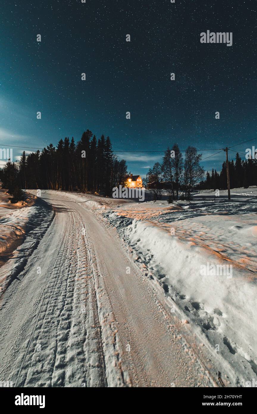 Snowy road at night Stock Photo - Alamy