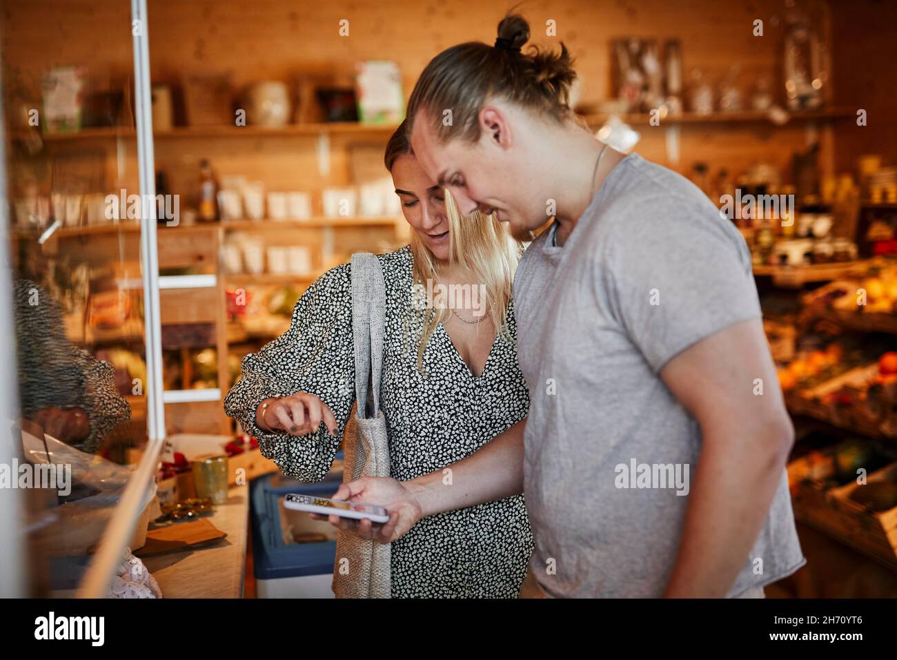 Person using cell phone to pay at store hi-res stock photography and ...