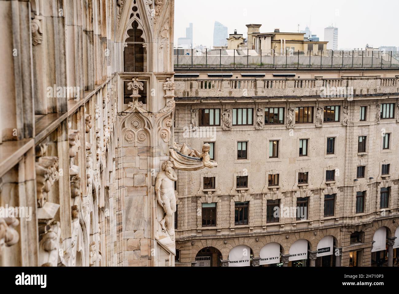 Facade of the Duomo against the backdrop of a modern building. Italy ...