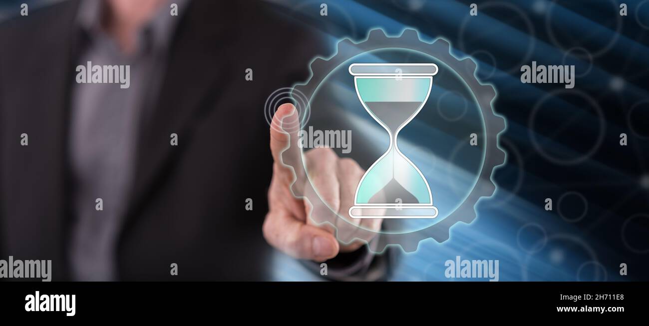 Man touching a time management concept on a touch screen with his ...