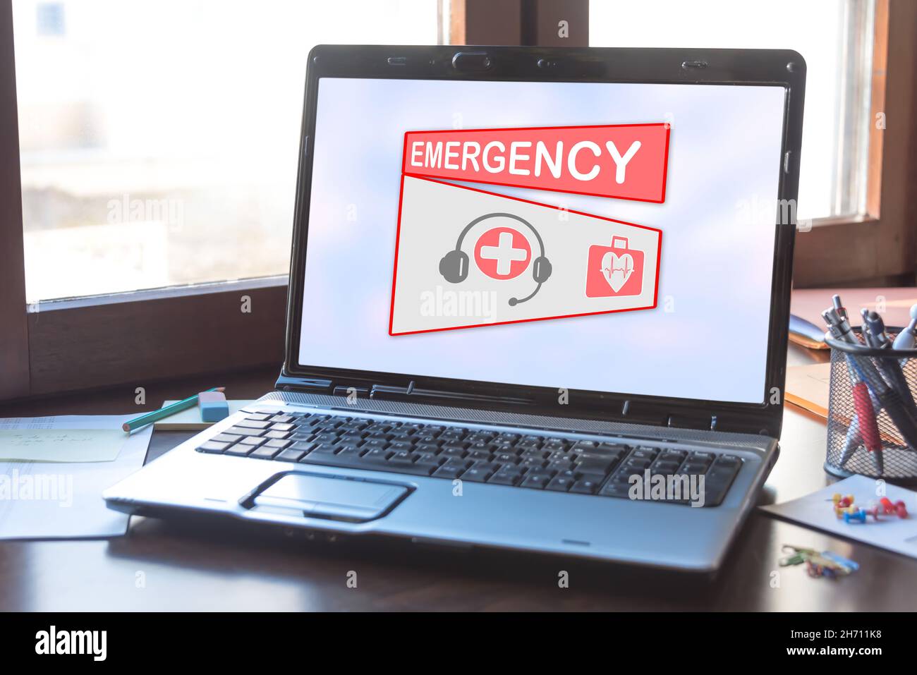 Laptop screen displaying an emergency concept Stock Photo - Alamy