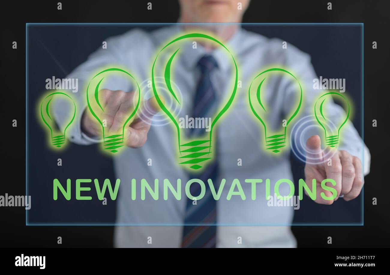 Man touching a new innovations concept on a touch screen with his ...