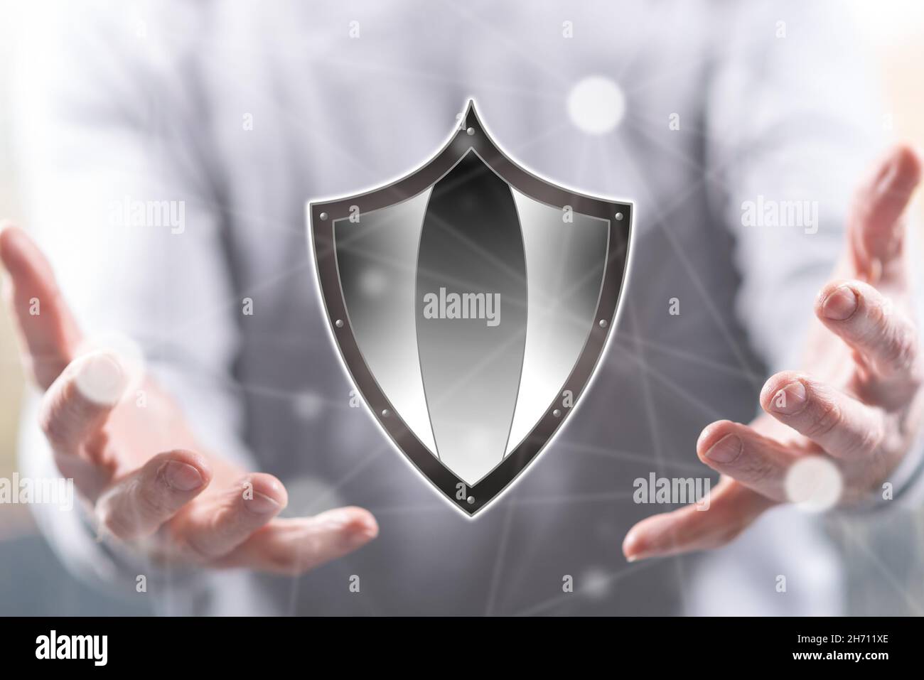 Protection concept above the hands of a man in background Stock Photo ...