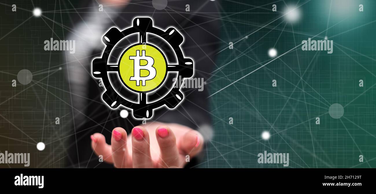 Bitcoin development concept above the hand of a woman in background ...