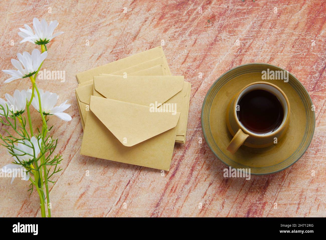 many envelope , tea cup and flower on table Stock Photo - Alamy